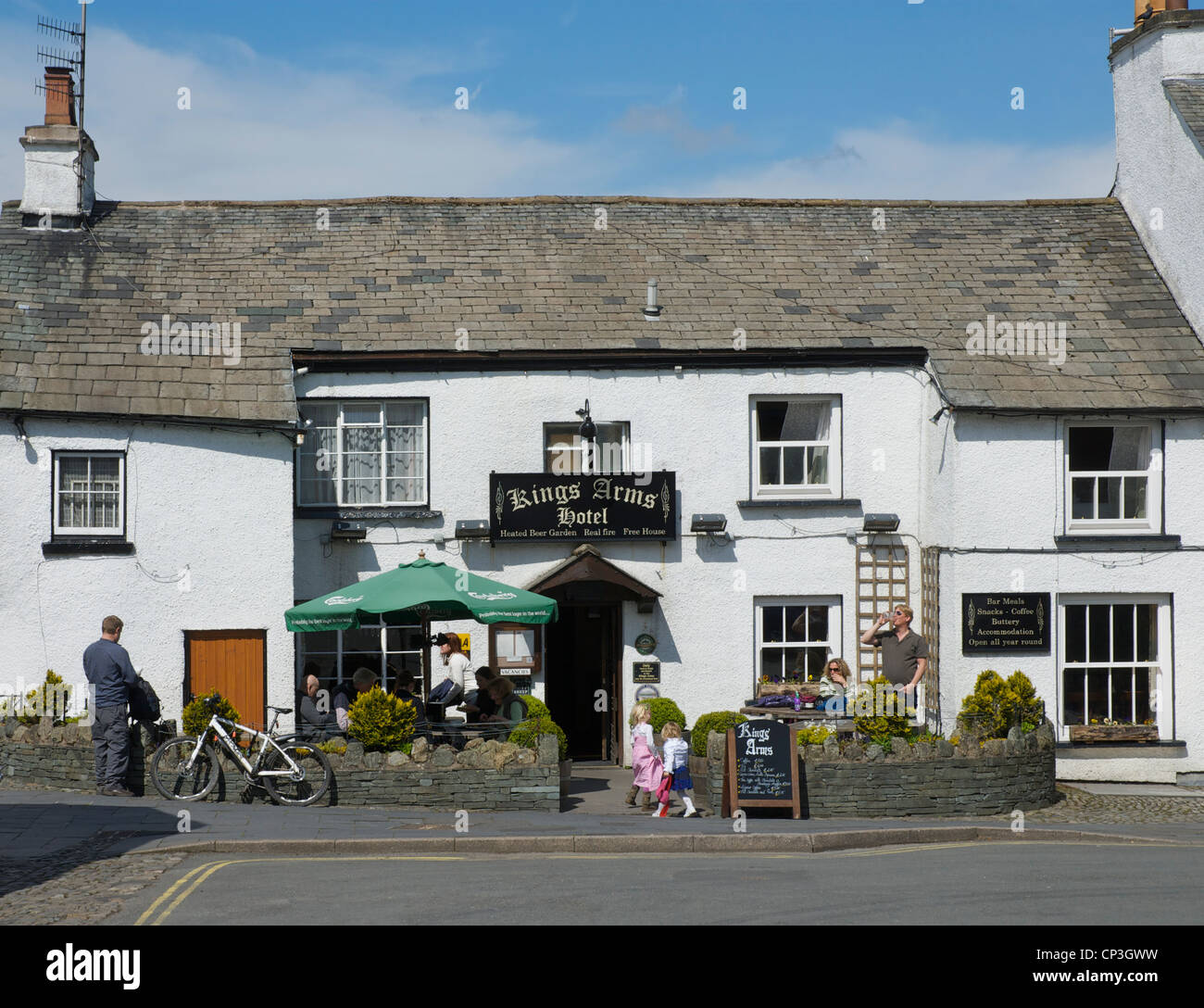 Drinking outside the Kings Arms Hotel in the village of Hawkshead, Lake ...