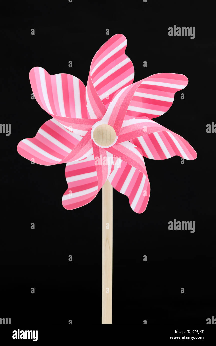 Colorful toy pinwheel on black background Stock Photo - Alamy