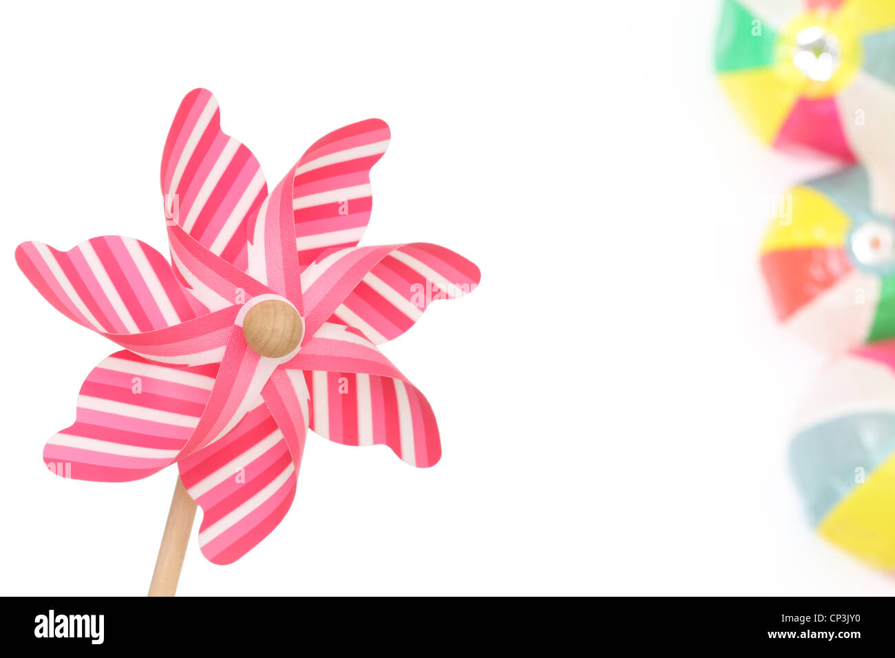 Colorful toy pinwheel on white background Stock Photo - Alamy