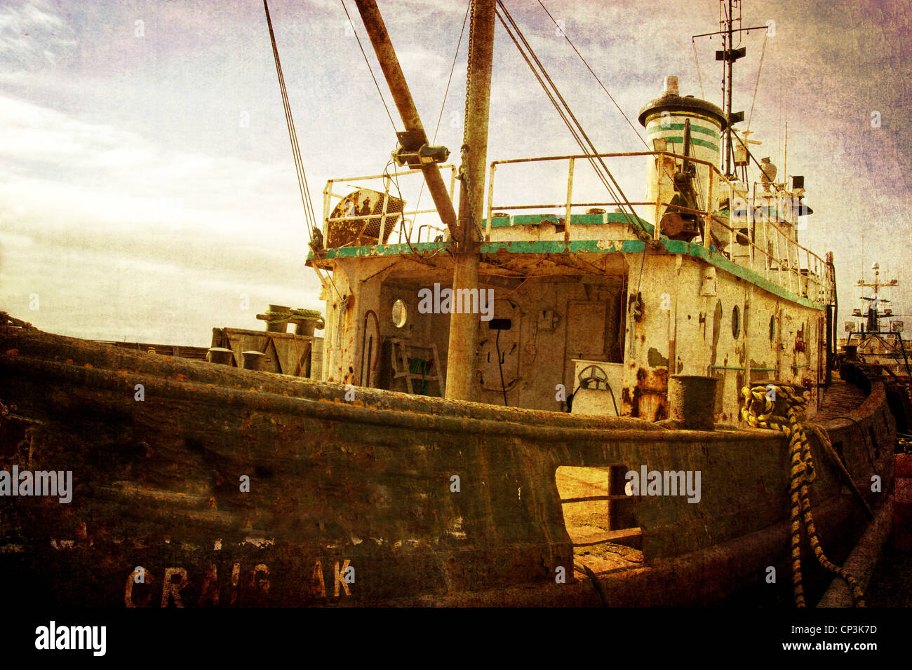 Old vintage fishing trawler in the harbor enhanced with texture layers ...