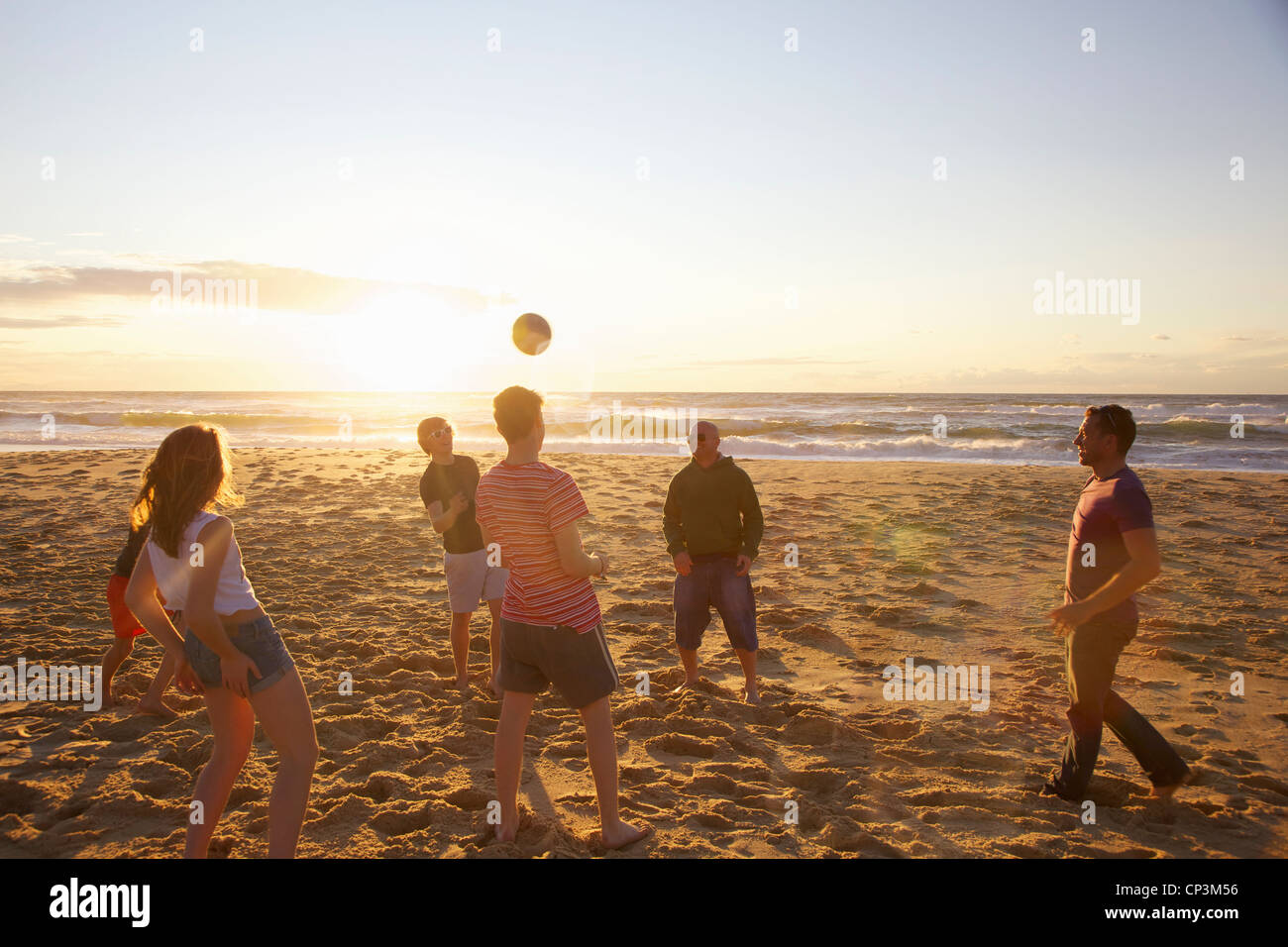 Group of People Playing Volleyball on Beach Stock Photo - Alamy