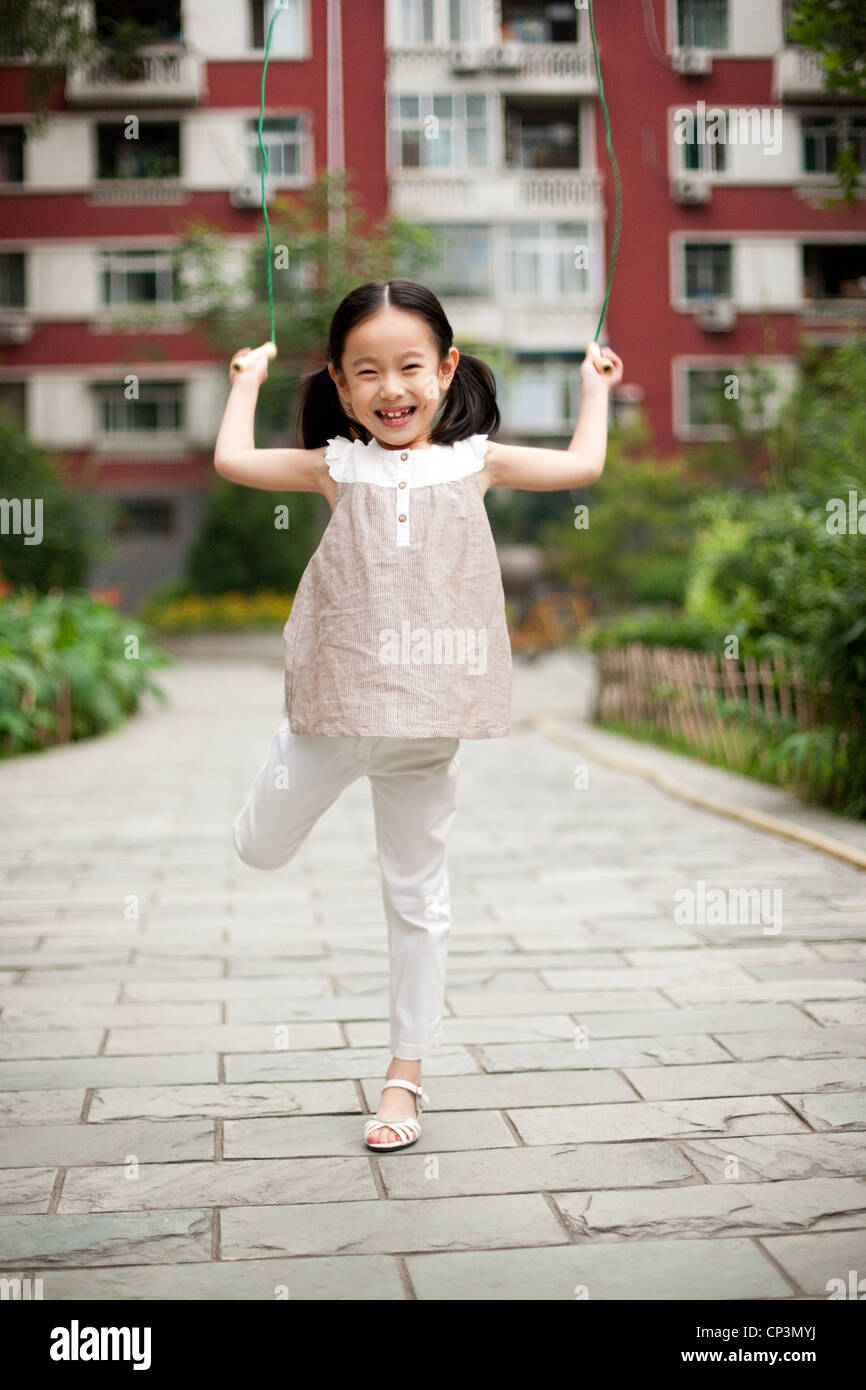 Chinese girl jumping rope Stock Photo - Alamy