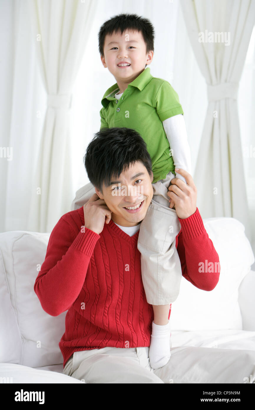 Chinese father playing with son Stock Photo - Alamy