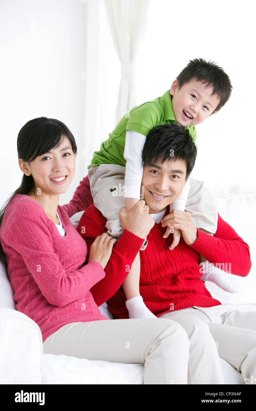 Young Chinese family in living room Stock Photo - Alamy