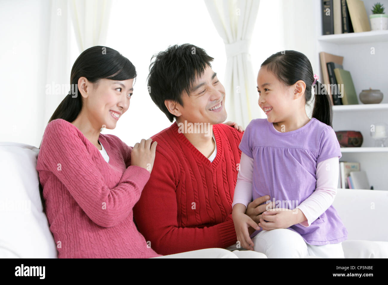 Young Chinese family in living room Stock Photo - Alamy