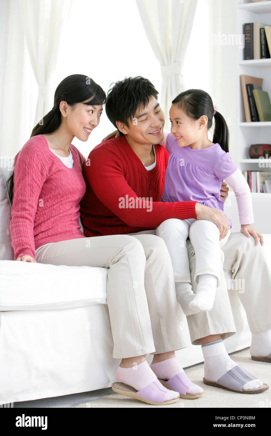 Young Chinese family in living room Stock Photo - Alamy