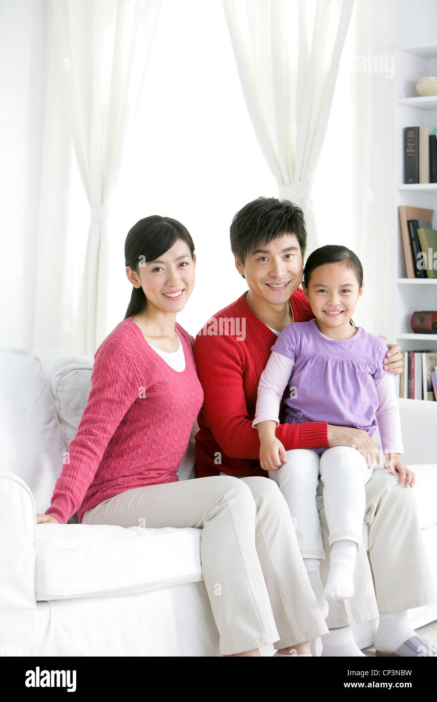 Young Chinese family in living room Stock Photo - Alamy