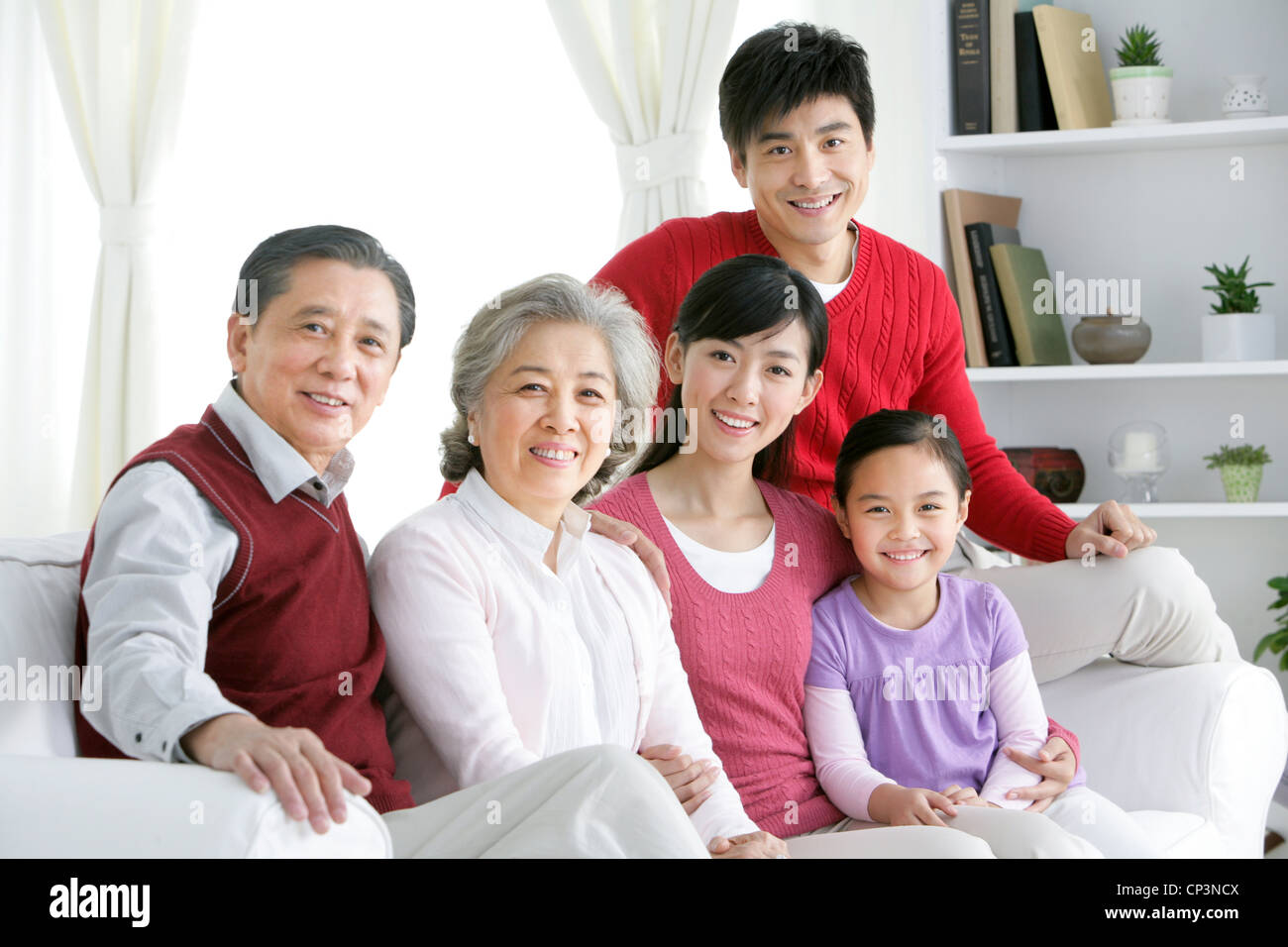 Chinese family portrait in living room Stock Photo - Alamy