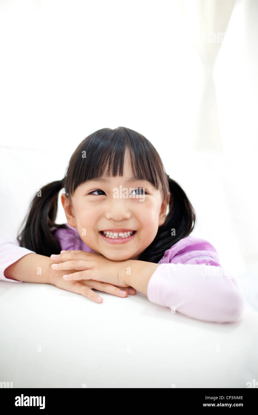 Chinese girl daydreaming Stock Photo - Alamy