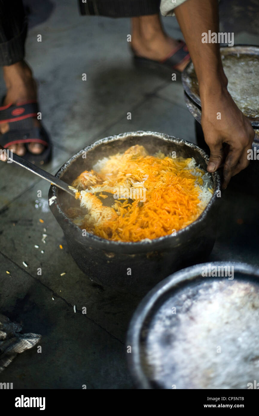 A chef making biryiani at Babu Shahi Bawarchi, New Delhi, India Stock ...