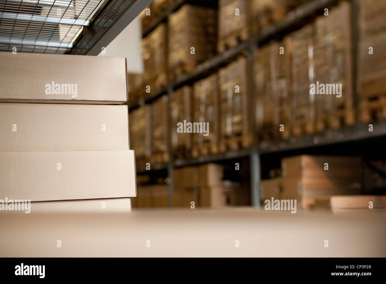 Boxes in a warehouse Stock Photo - Alamy