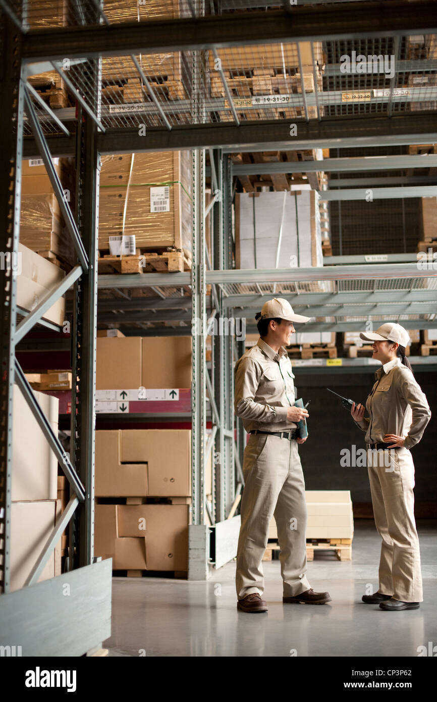 Male and female Chinese warehouse worker Stock Photo - Alamy