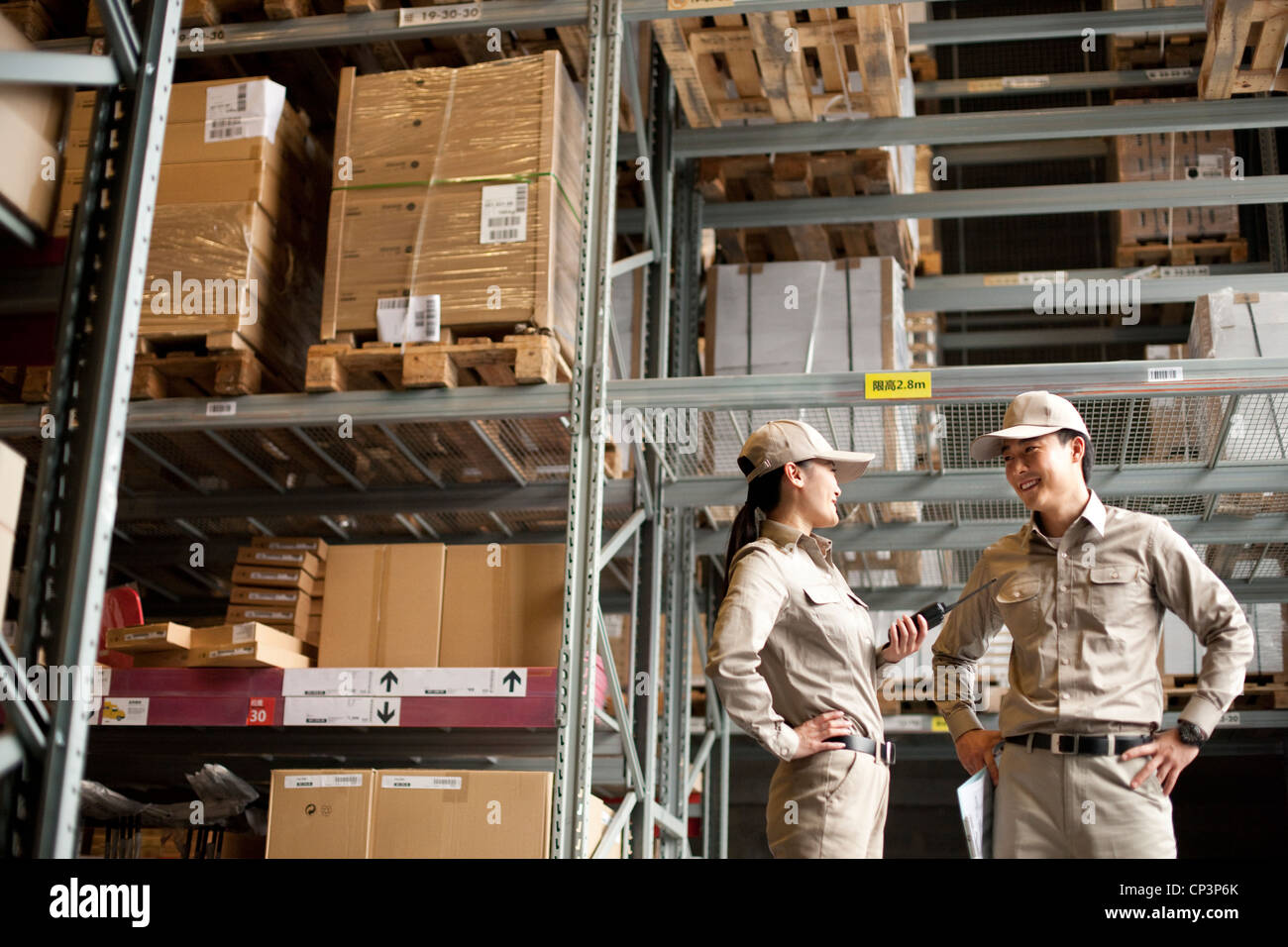 Male and female Chinese warehouse worker Stock Photo - Alamy
