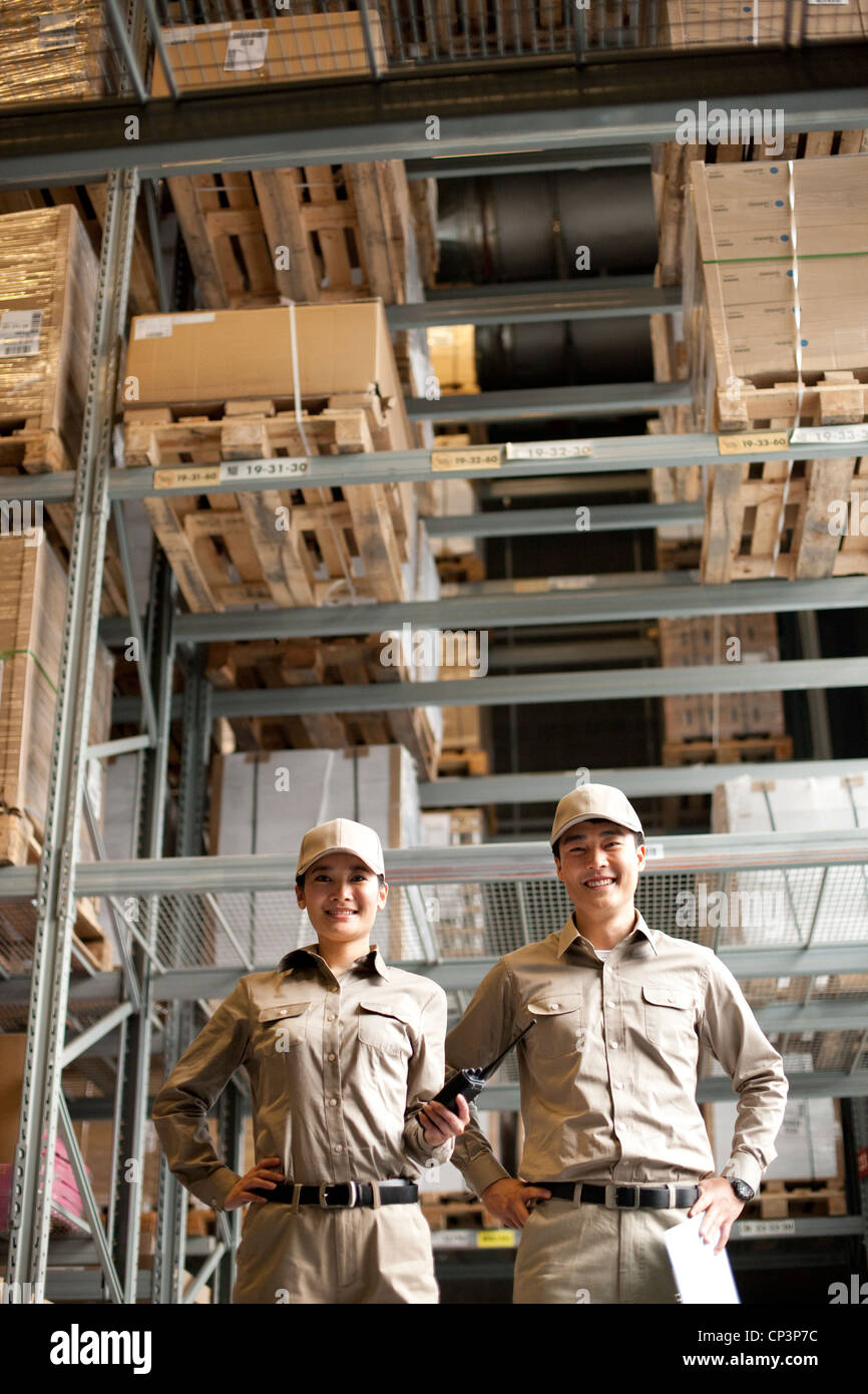 Male and female Chinese warehouse worker Stock Photo - Alamy