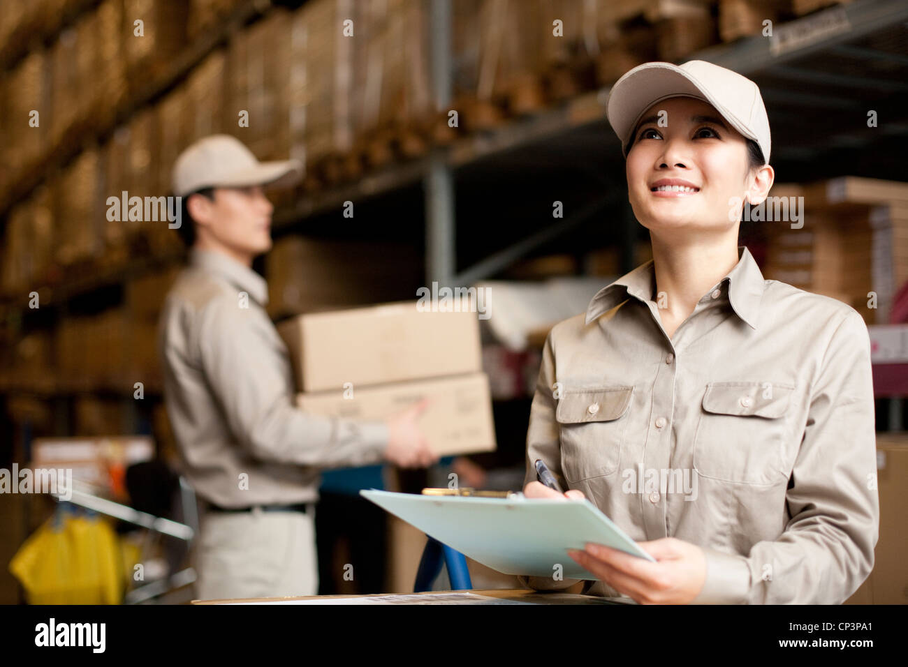 Chinese warehouse workers doing inventory Stock Photo - Alamy