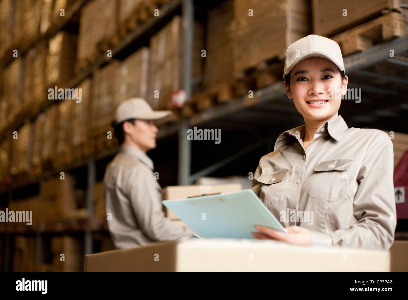 Chinese warehouse workers doing inventory Stock Photo - Alamy