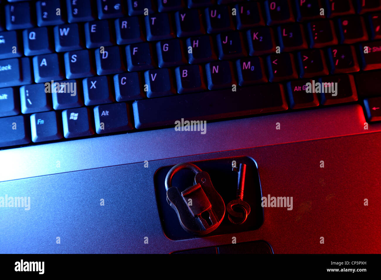 Security . Classic padlock and key with contemporary lighting on ...