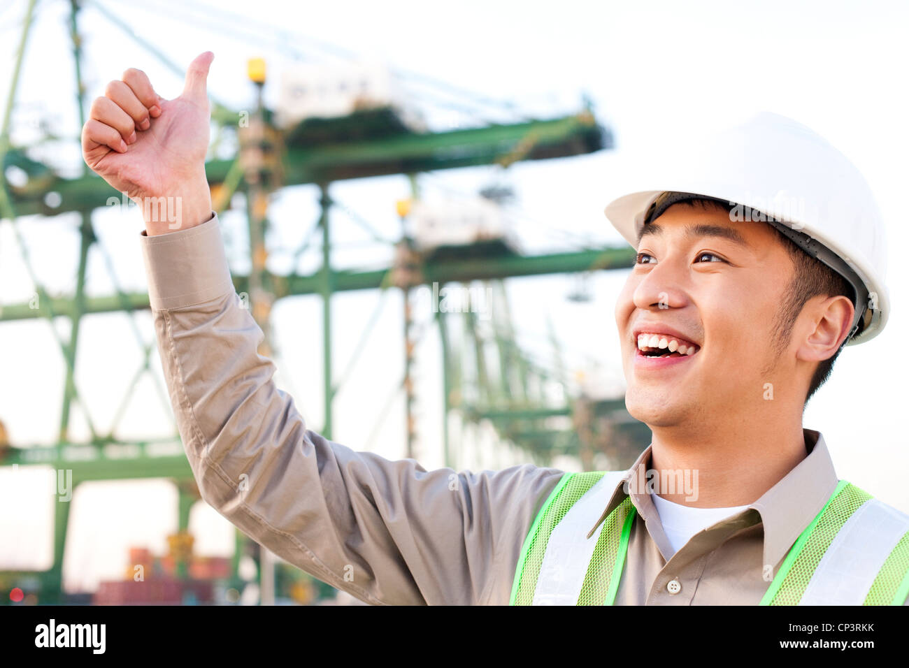shipping industry worker giving the thumbs-up signal Stock Photo - Alamy