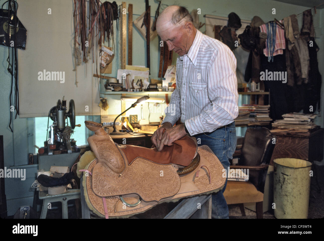 Cowboy building a saddle Stock Photo - Alamy