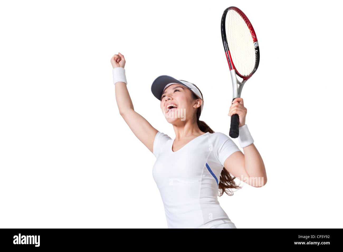 Young woman playing tennis and cheering Stock Photo - Alamy