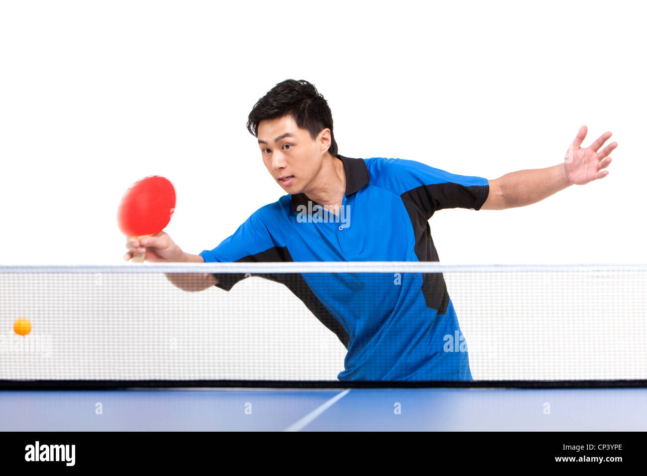 Table tennis player hitting ball Stock Photo - Alamy