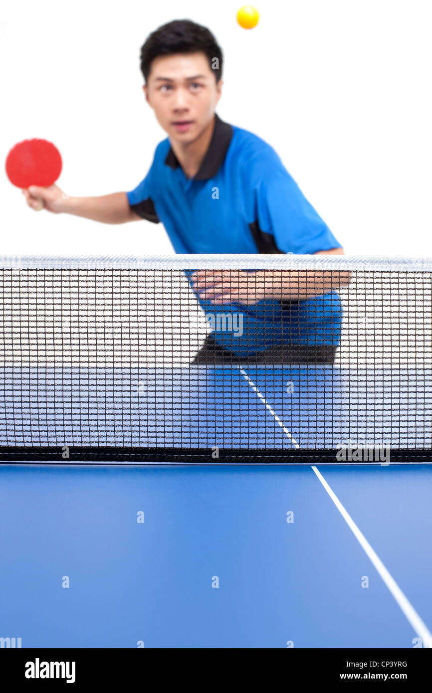 Table tennis player hitting ball Stock Photo - Alamy