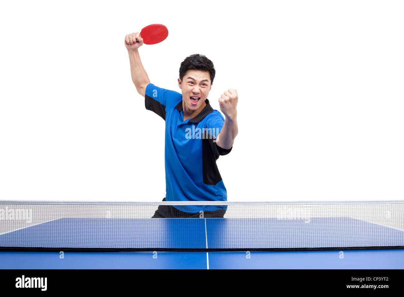 Table tennis player cheers with fists balled Stock Photo - Alamy