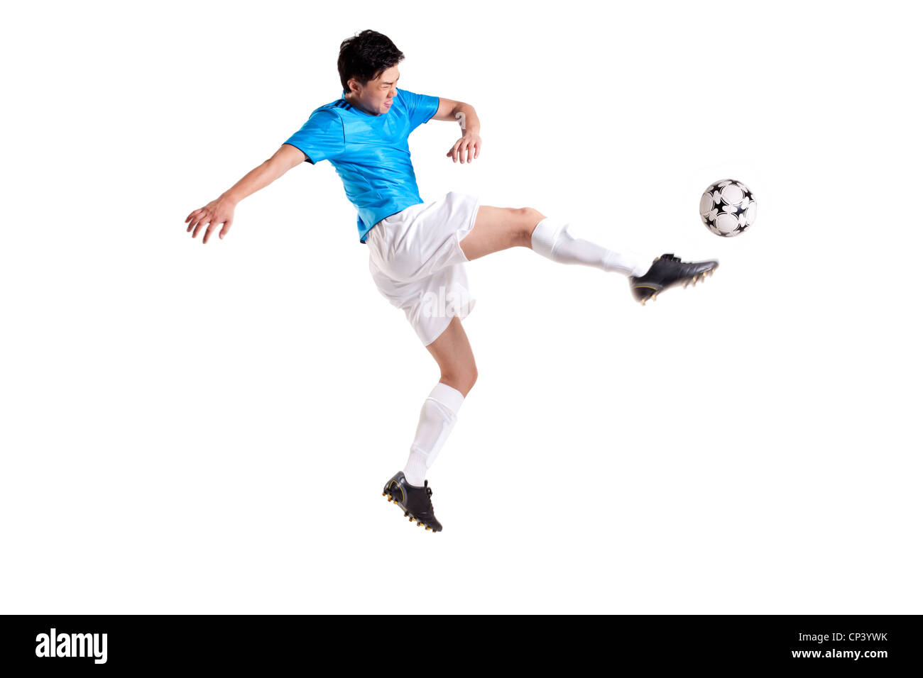 Football player kicking shot on Cut Out Stock Images & Pictures - Alamy