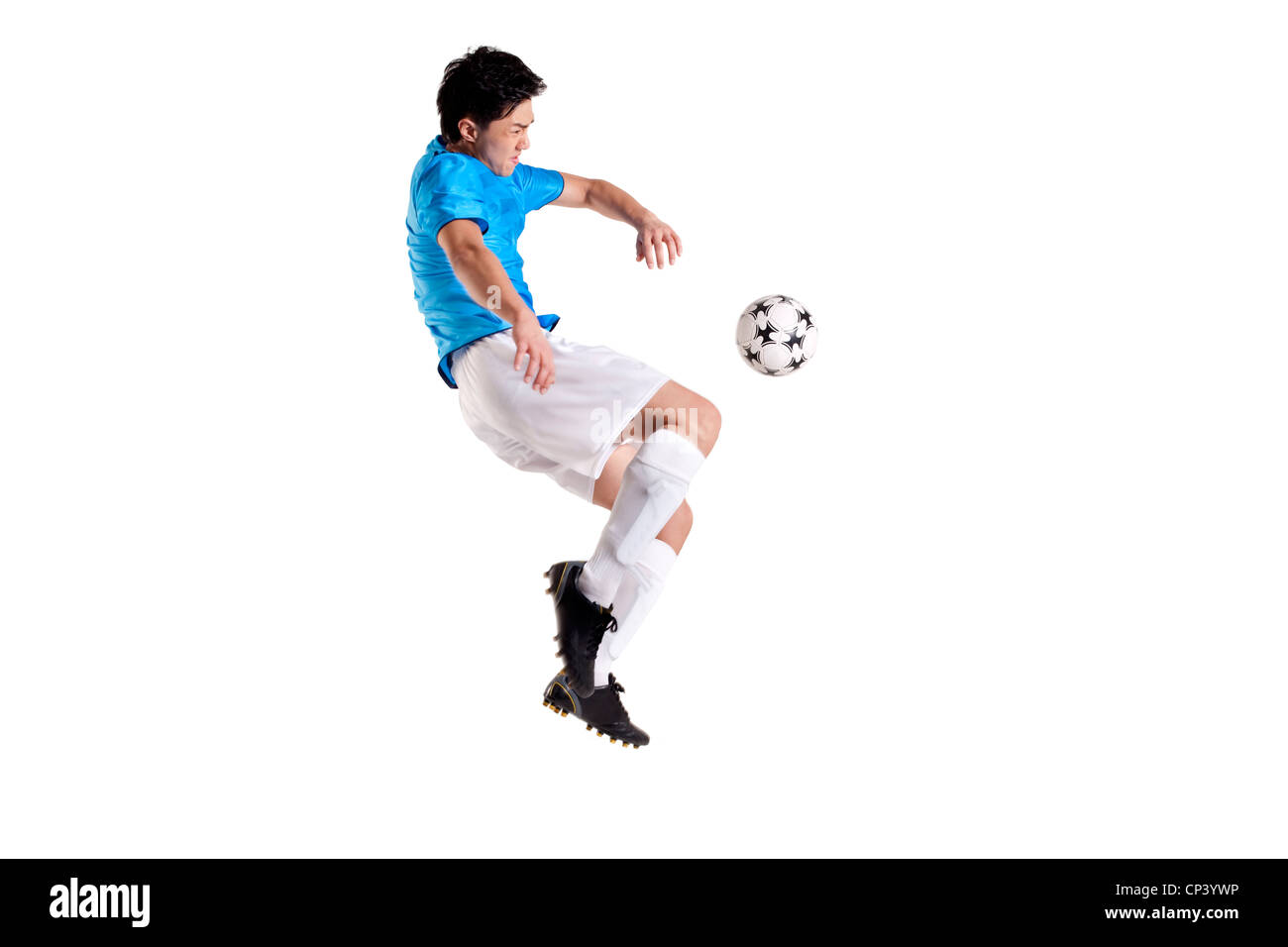 Soccer player jumping Stock Photo - Alamy