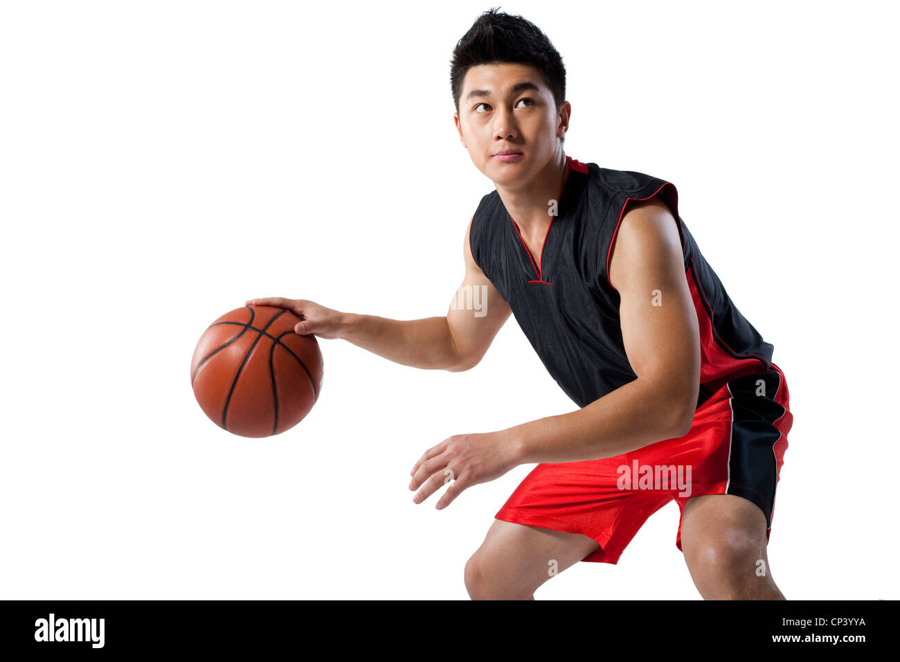 Man dribbling basketball Stock Photo - Alamy