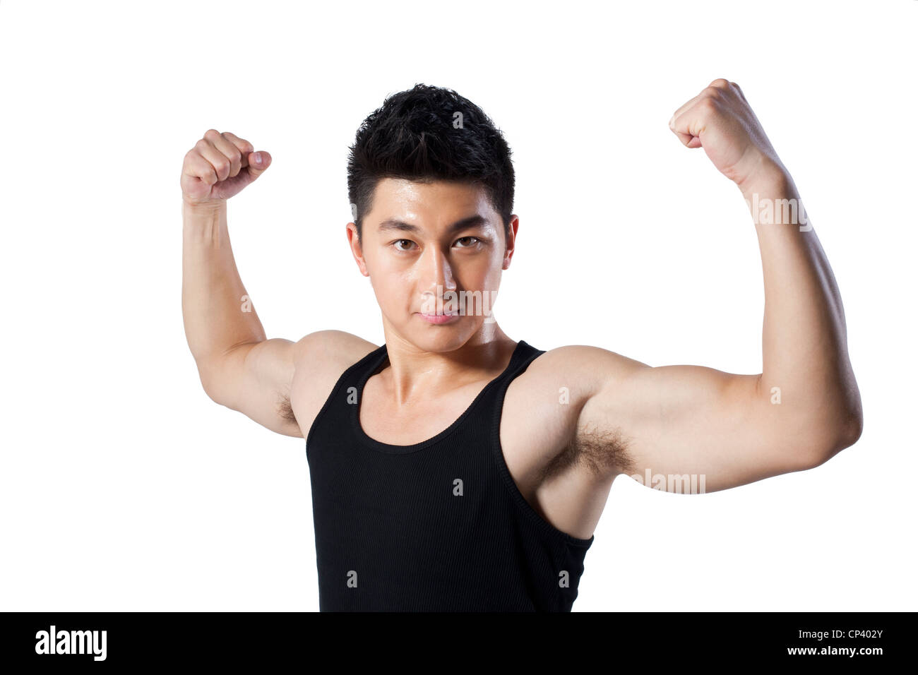 Man flexing his muscles Stock Photo - Alamy