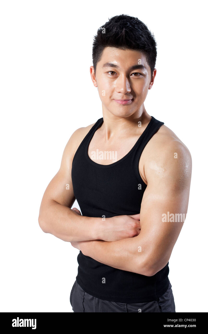Muscular man with arms crossed Stock Photo - Alamy