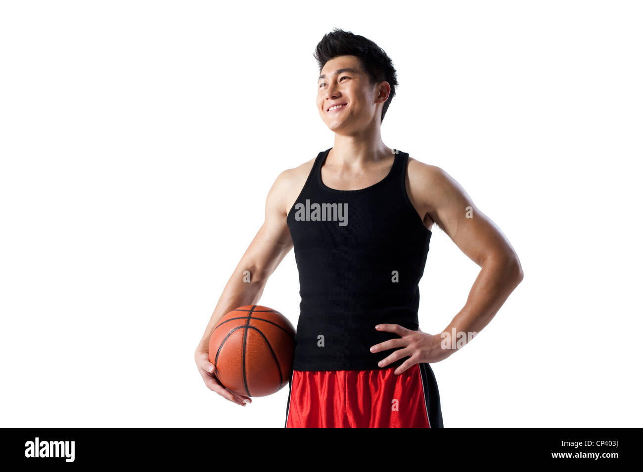 Man standing with basketball Stock Photo - Alamy