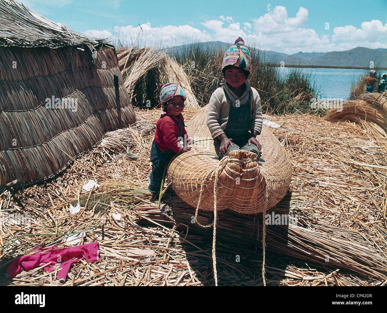 Peru - Lake Titicaca - Children playing on a balsa Uru, traditional ...