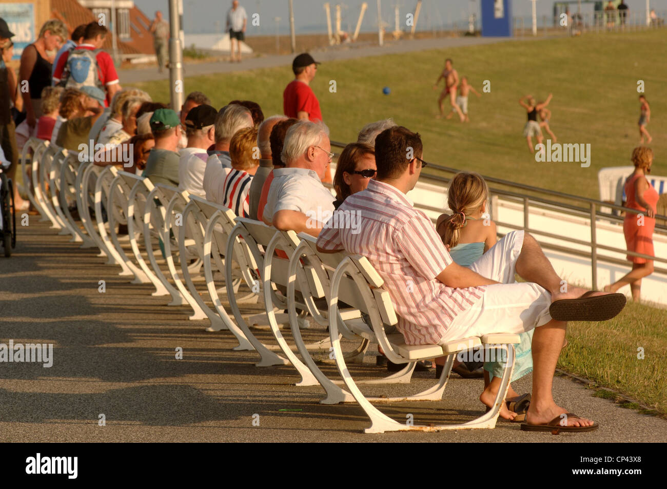 Germany - Schleswig-Holstein - Busum. People look sitting on the ...