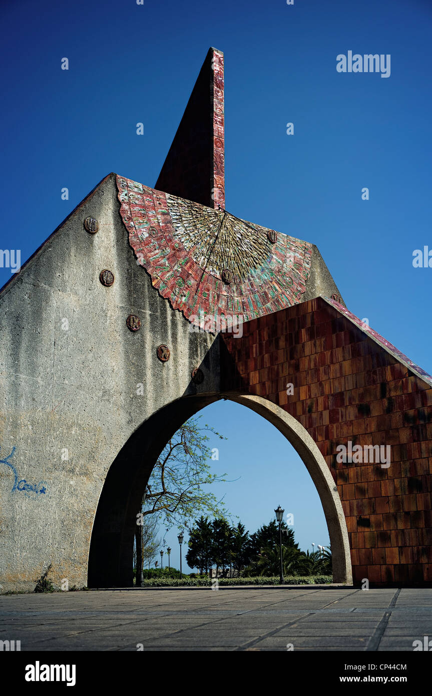 Architecture of a sundial on a wall and an arch with tiles and ceramics ...