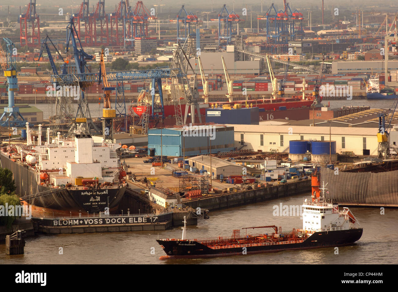 Germany Hamburg. Port area on river Elbe. To left of pier of shipyards ...