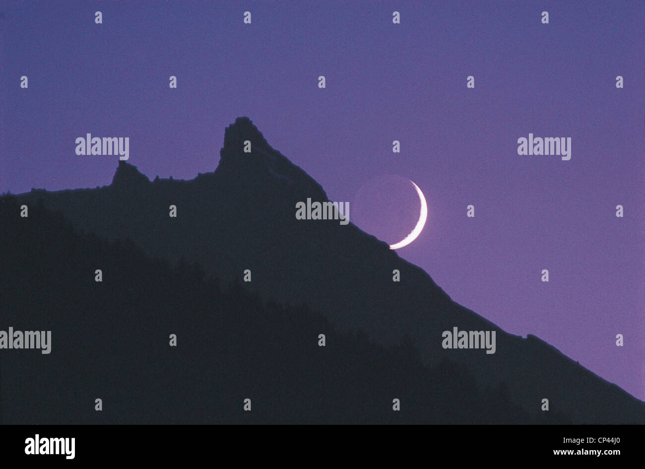Valle D'Aosta. Cogne Valley, the moon rises behind the Punta Pousset ...