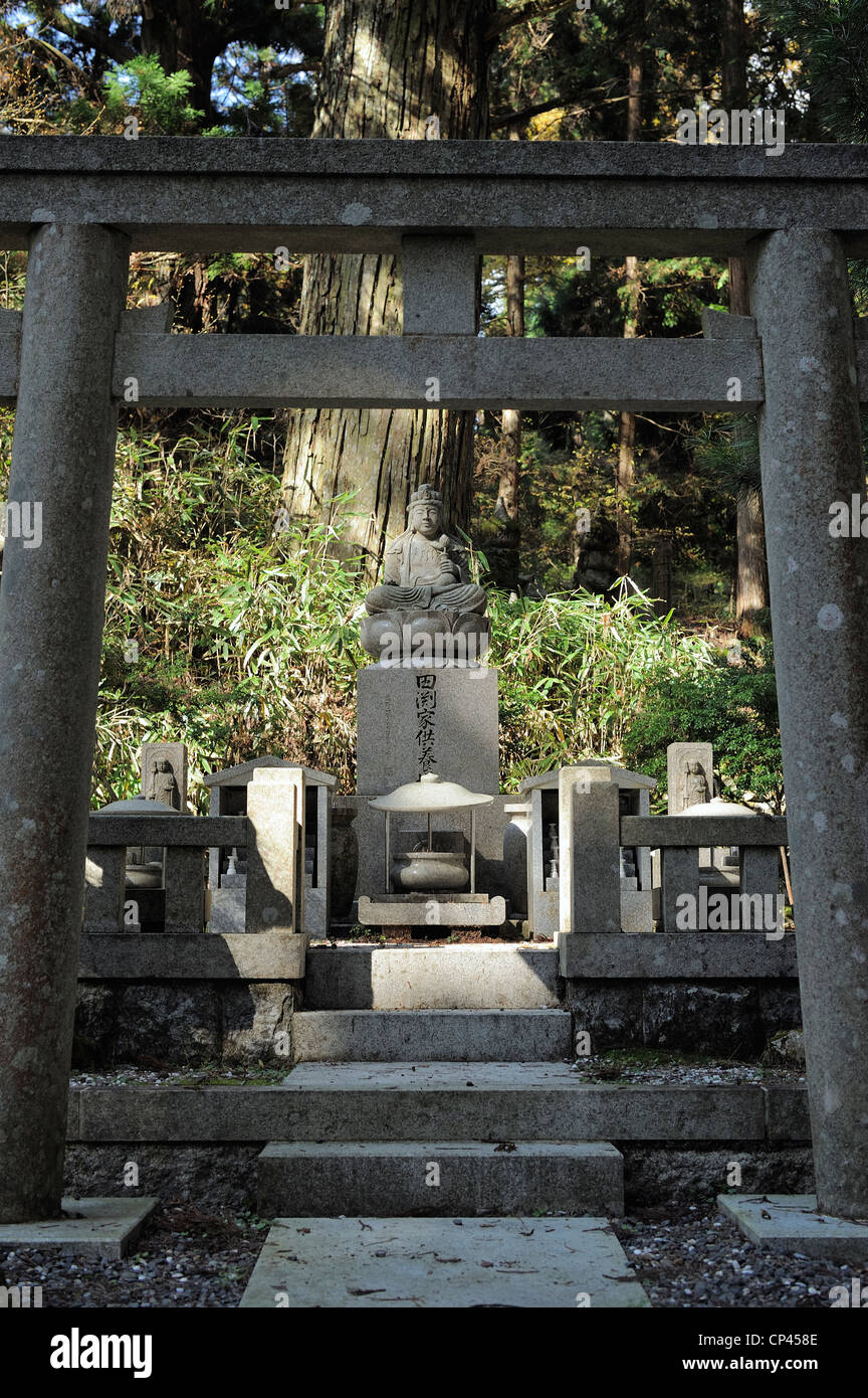 stone torii at memorial at Okunoin cemetery, Koya-San, Japan Stock ...