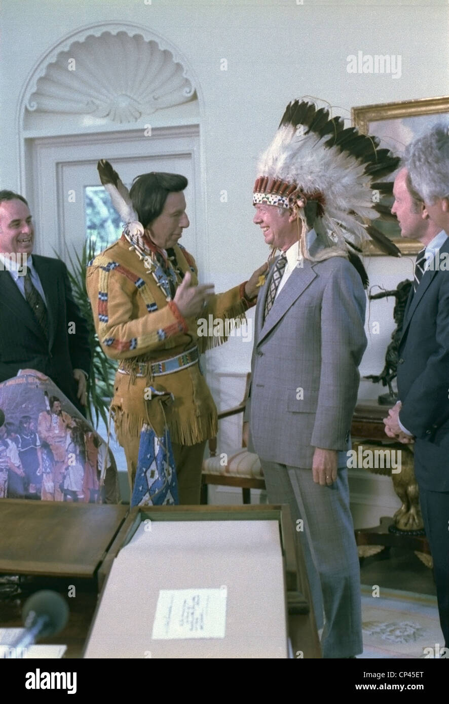 President Jimmy Carter wearing a feathered headdress presented to him ...