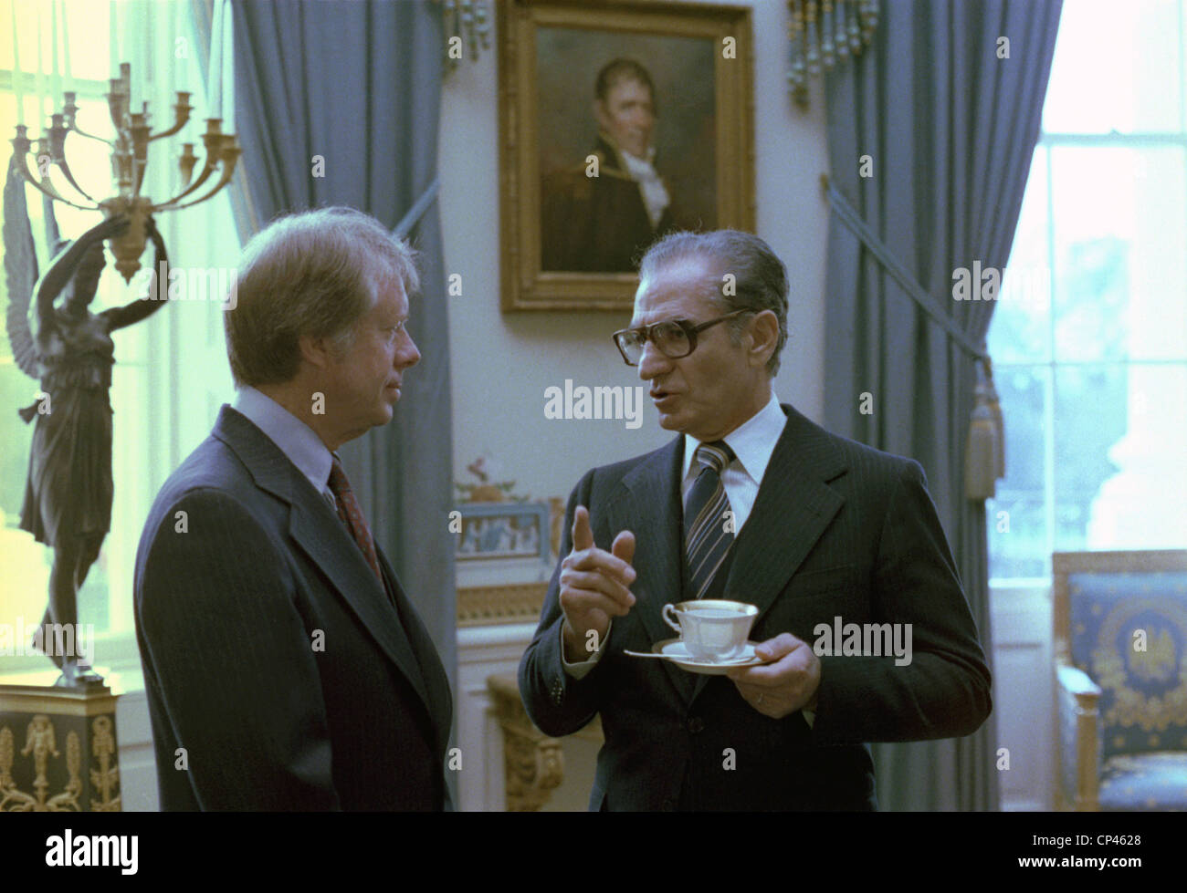 Jimmy Carter and the Shah of Iran talk in the Oval office during his ...