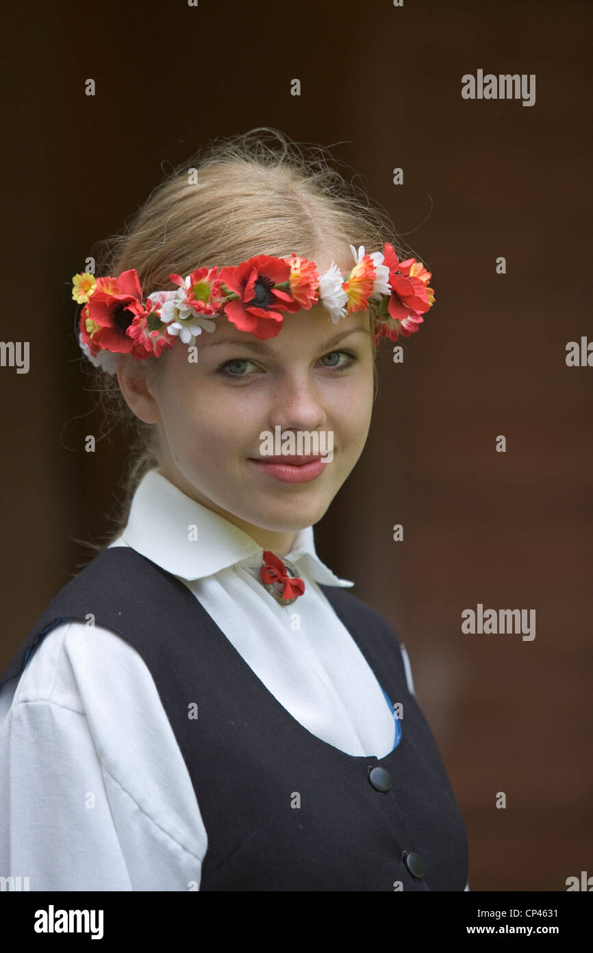 Latvia - Folk festival. Girl in traditional costume with a crown of ...