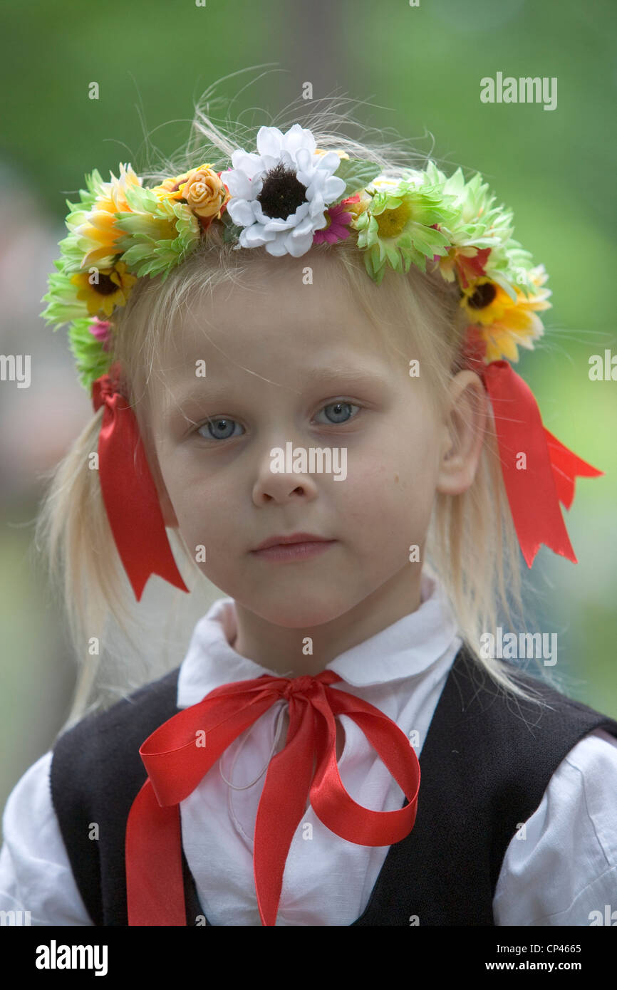 Latvia - Folk festival. Girls in traditional costume with a crown of ...