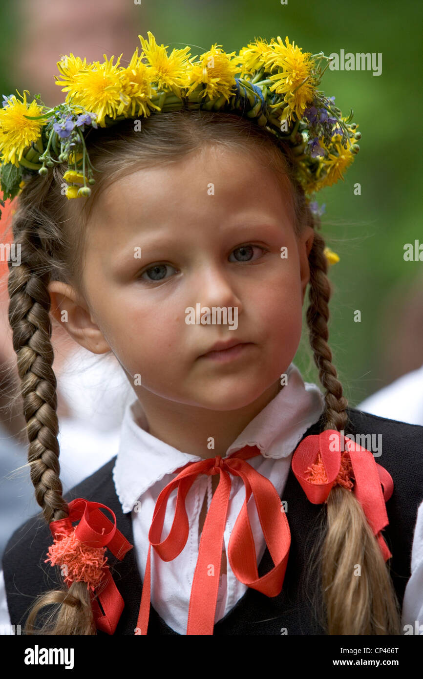 Latvia - Folk festival. Girls in traditional costume with a crown of ...