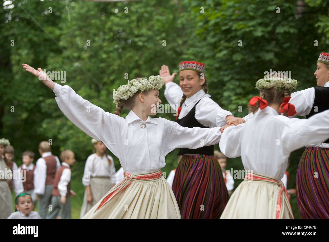 Latvia - Folk festival. Girls in traditional costume as they perform a ...