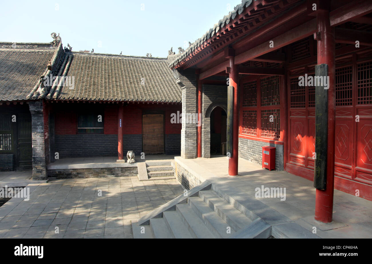 it's a temple in china where monks are praying. All the walls are red ...