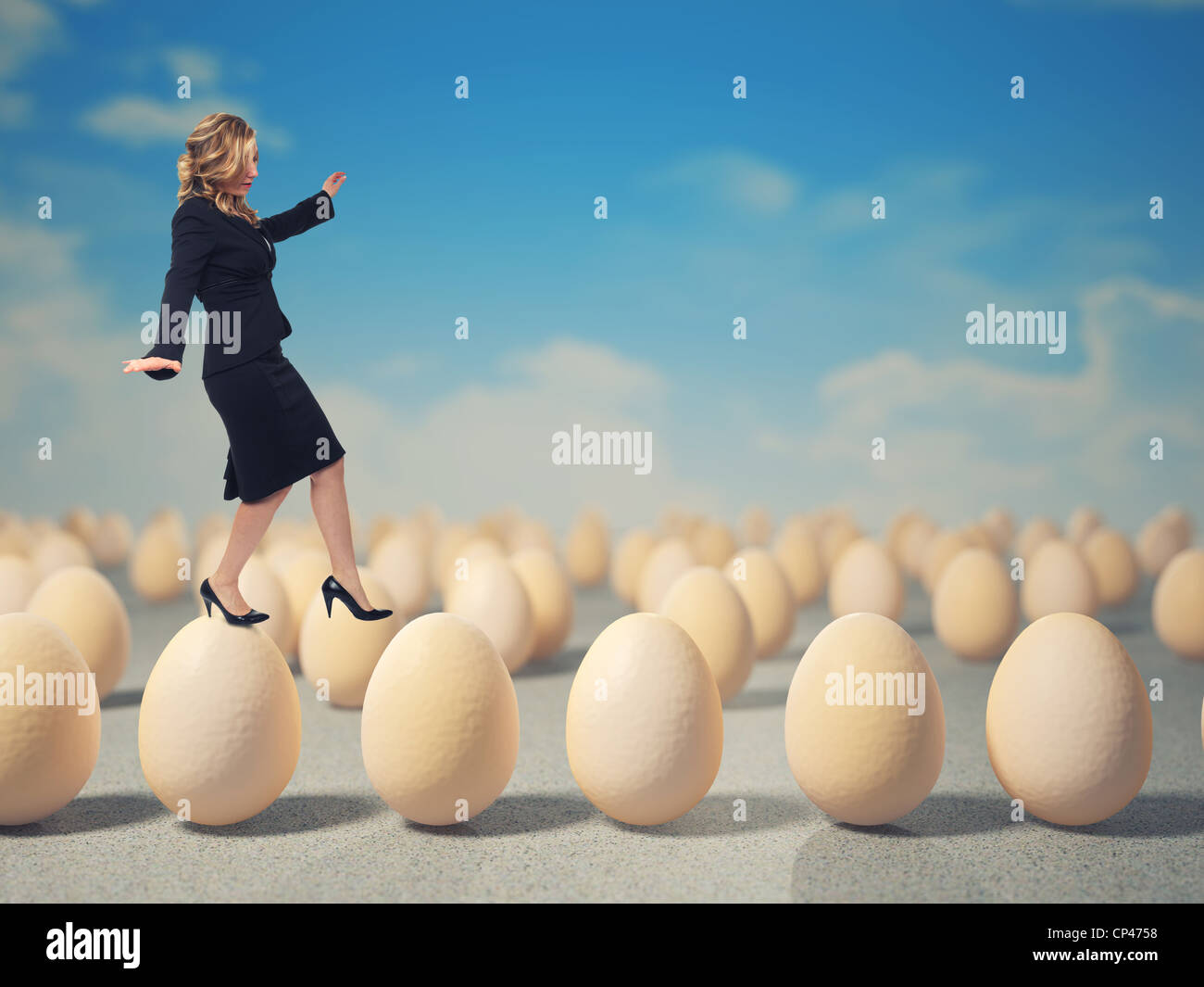 caucasian businesswoman walk on 3d eggs Stock Photo - Alamy