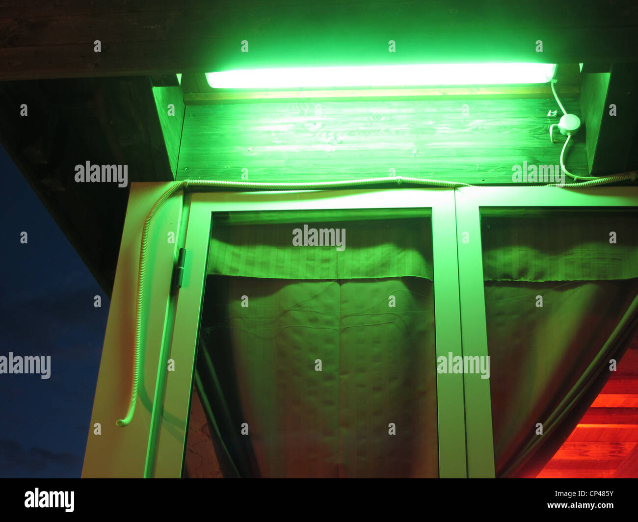 shop window with neon fluorescent light at night in italy Stock Photo ...