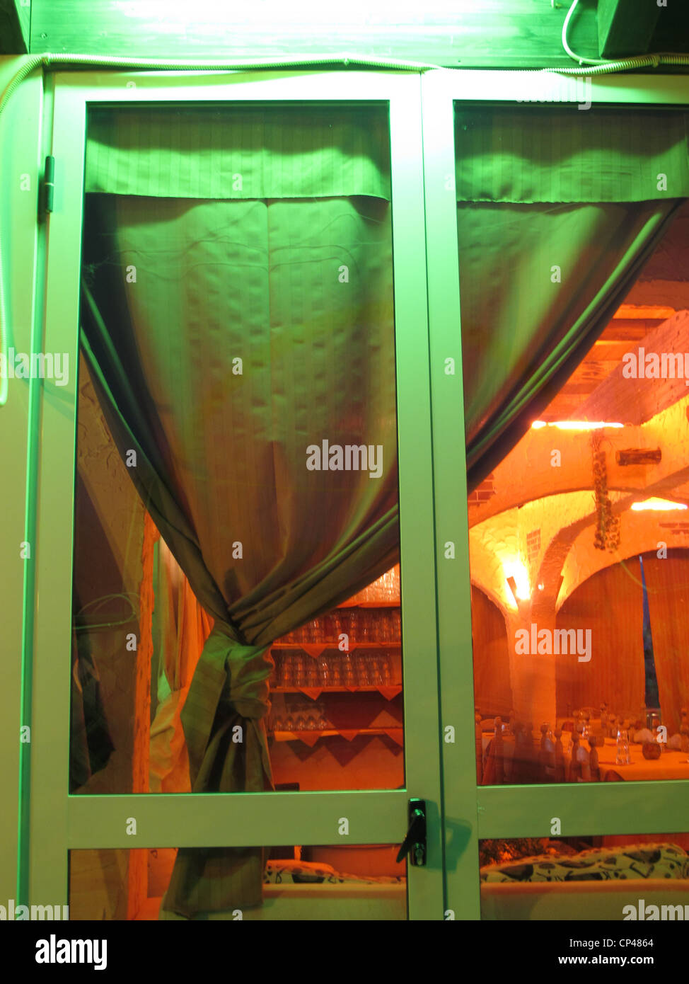 shop window with neon fluorescent light at night in italy dark bright ...