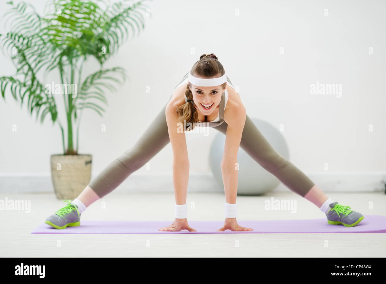 Happy healthy girl doing stretching exercises Stock Photo - Alamy
